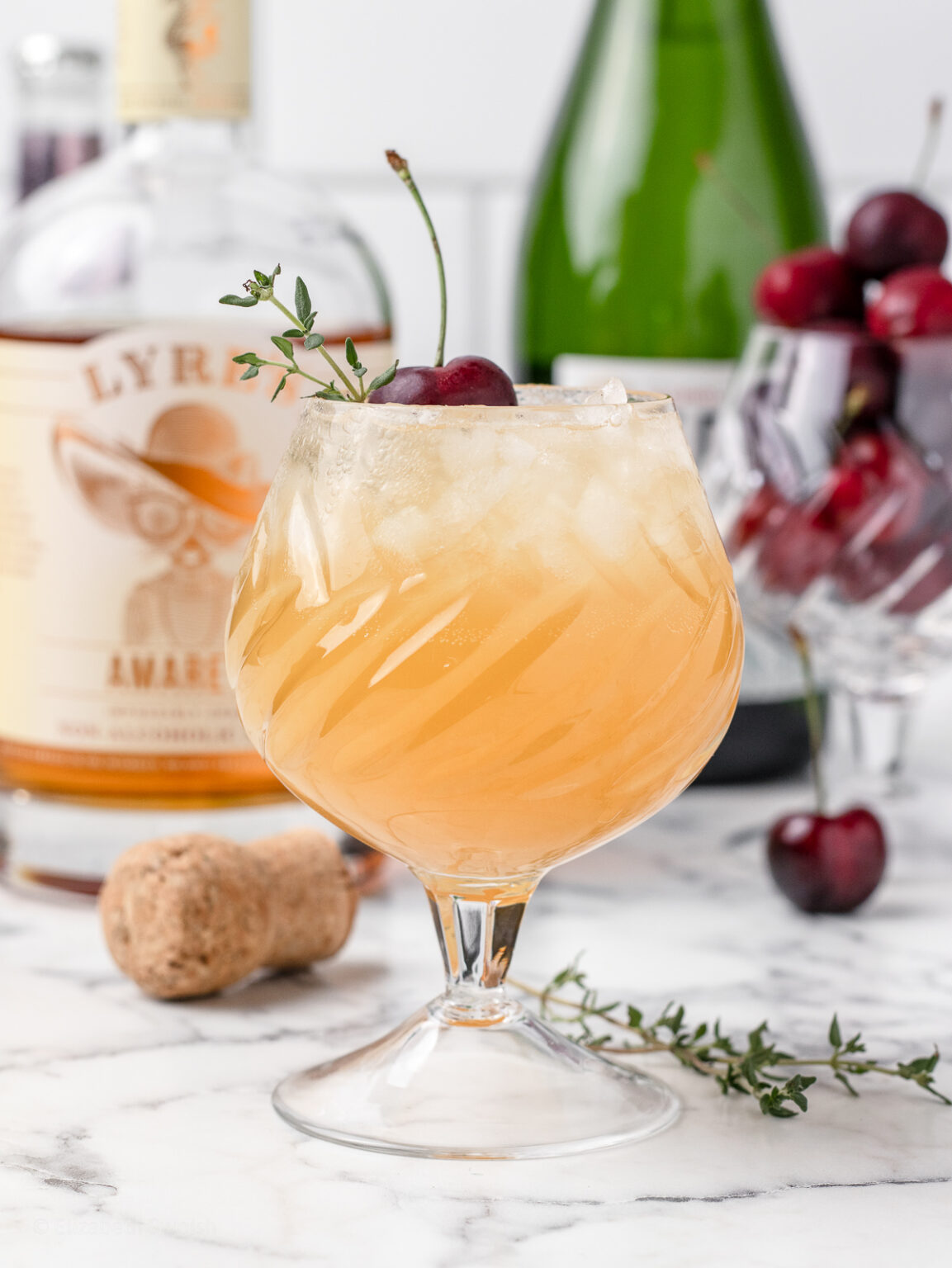 Amaretto Spritz Mocktail - Entirely Elizabeth